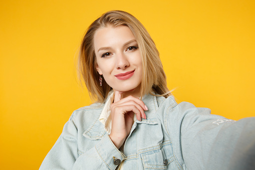 Close Up Selfie Shot Of Attractive Smiling Young Woman In Denim Casual