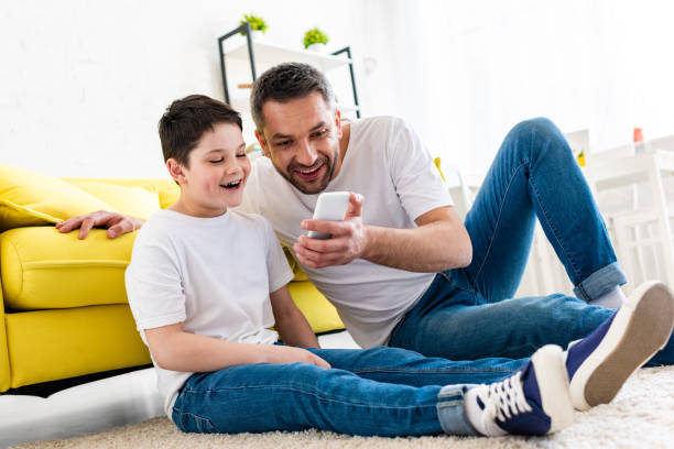 Free Stock Photo of Father and son compete in online games on ...