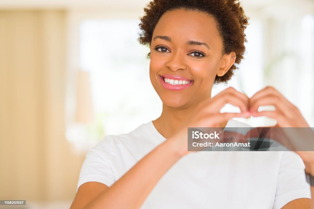 Young Beautiful African American Woman Wearing Casual White Tshirt