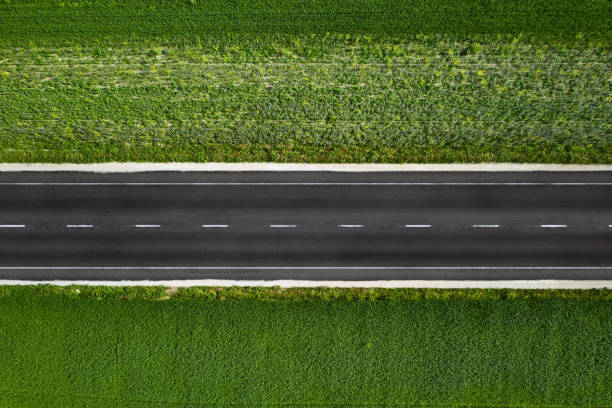 Free Stock Photo of Aerial View of Road Cutting Through Field ...