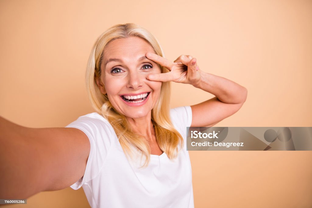 Photo Of Beautiful Lady Make Selfies Vsign Symbol Near Eye Say Hi Hello
