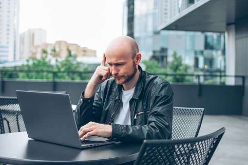Thinking Attractive Adult Successful Bald Bearded Man In Black Jacket