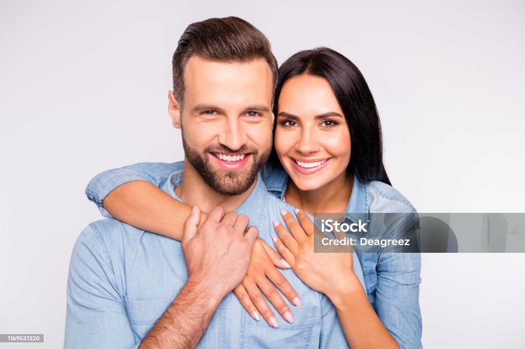 Close Up Photo Of Sweet Lady And Guy With Toothy Smile Cuddling Wearing