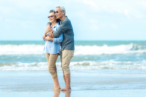 Asian Lifestyle Senior Couple Hug On The Beach Happy In Love Romantic