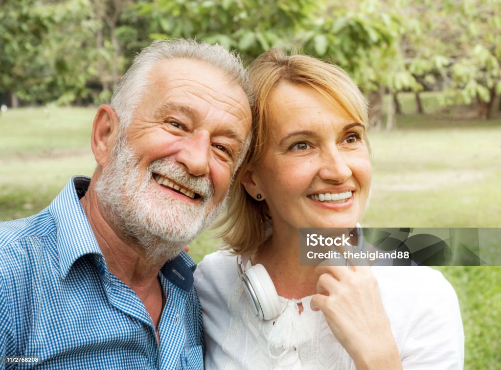 Senior Couple Together Enjoying Romantic Walk In Golden Park Happy Life