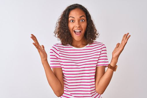 Young Brazilian Woman Wearing Pink Striped Tshirt Standing Over