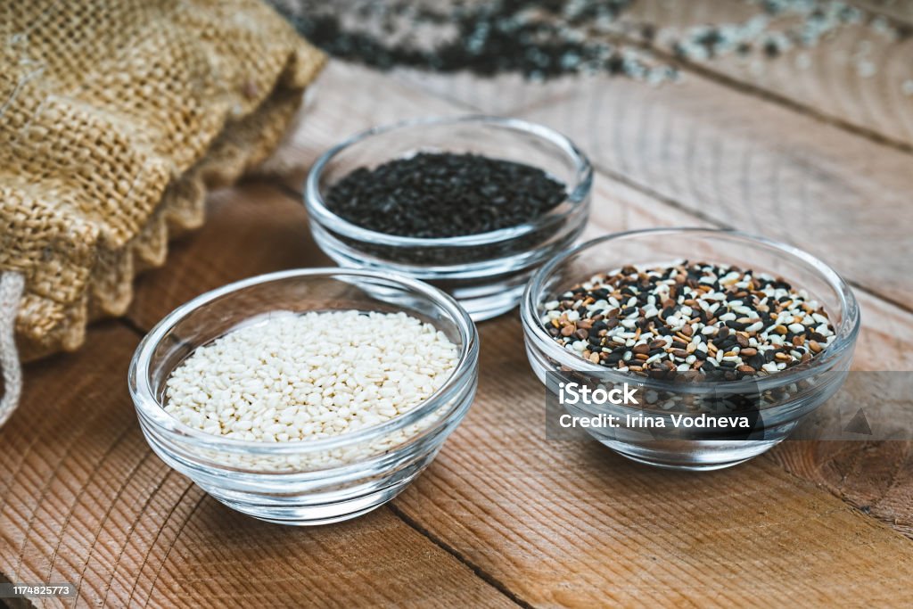 Different Types Of Sesame Seeds White Black And Multicolored Sesame Seeds Seasonings On A Wooden