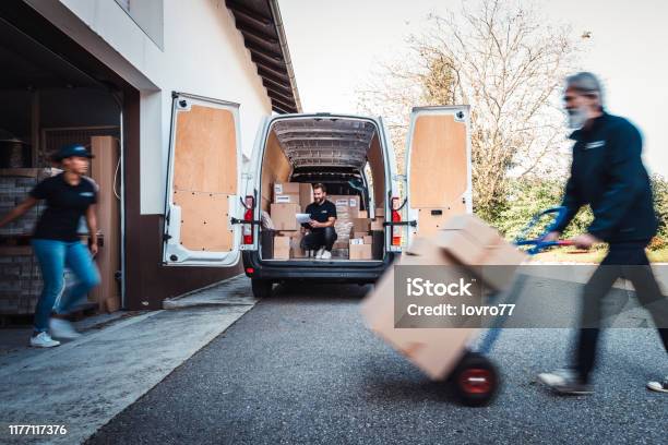 Coworkers Rushing To Load Packages In A Delivery Van Stock Photo ... Coworkers Rushing To Load Packages In A Delivery Van Stock Photo ...