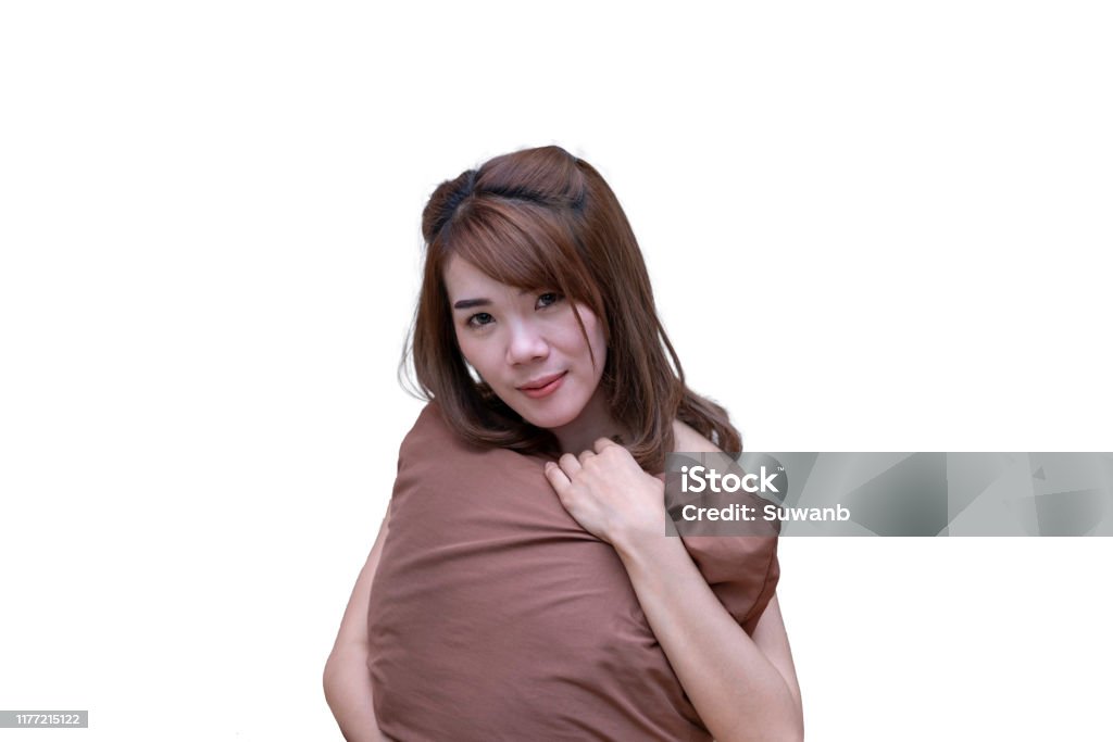 Portrait Of Young Beautiful Asian Woman Hugging Brown Pillow On