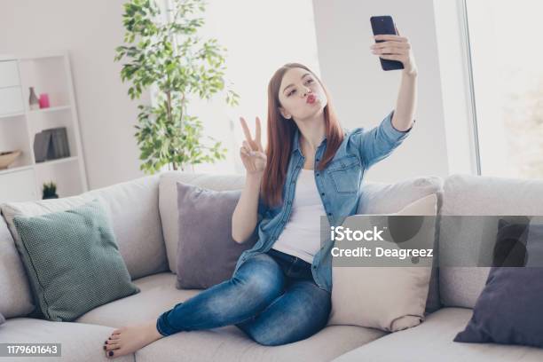 Photo Of Flirty Lady Telephone In Hands Making Selfies Showing Vsign
