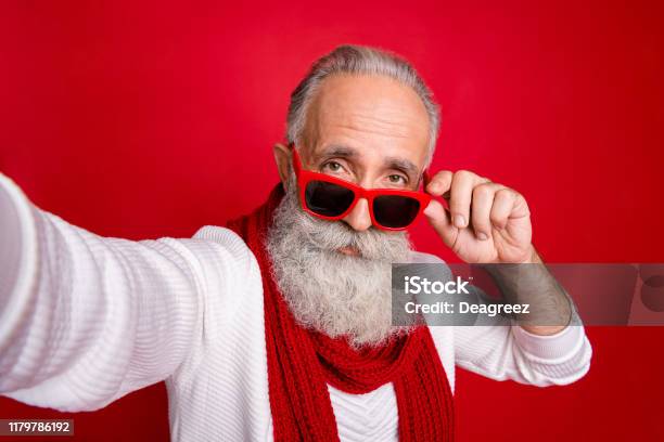 Fancy Grey Haired Santa Man Making Self Photos Wear Sun Specs Knitted Jumper Isolated Red