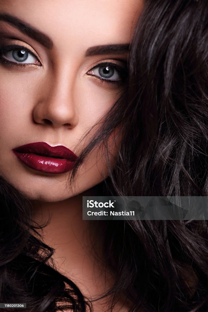 Beautiful Bright Makeup Woman With Long Black Curly Hair Style Burgundy