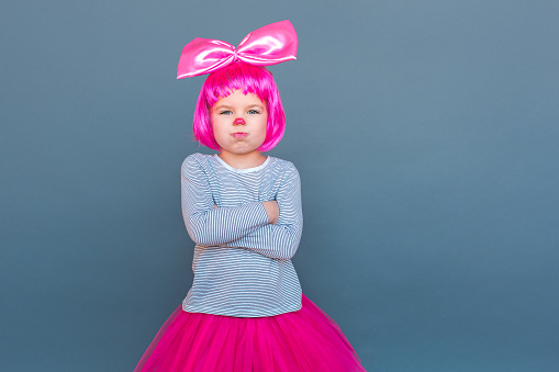 Portrait Of Offended Girlwearing Clown Costume Puffed Out Cheeks Stock