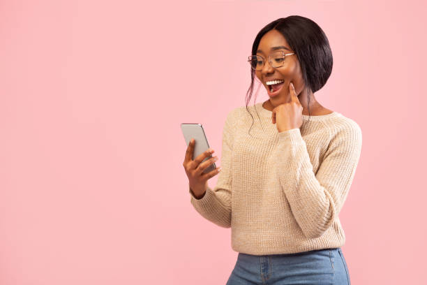 3,000+ Excited Black Woman Holding Phone Stock Photos, Pictures ... 3,000+ Excited Black Woman Holding Phone Stock Photos, Pictures ...