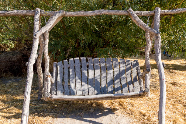 Free picture: Wooden rustic swing on rust cast iron chain close-up