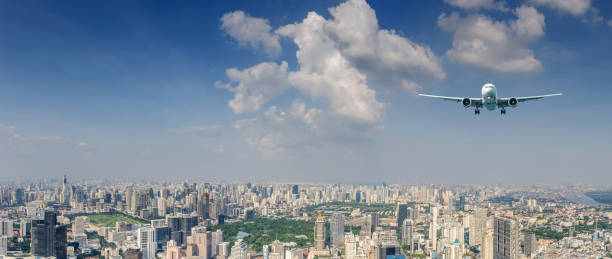 Free Stock Photo of Airplane Flying Over City Under Cloudy Sky ...