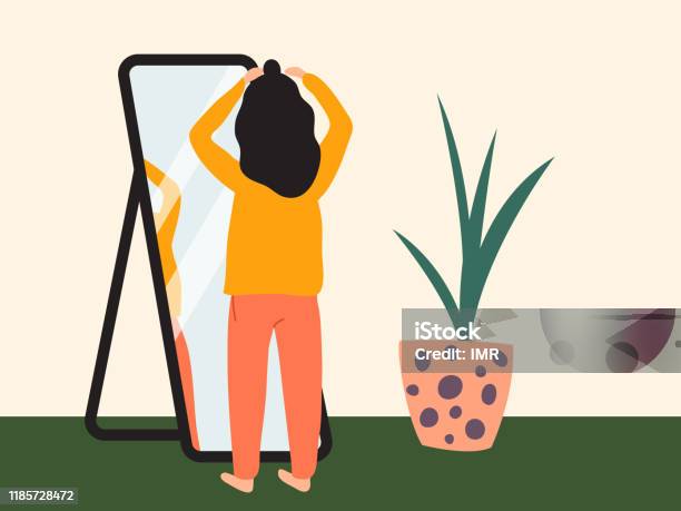 Darkhaired Girl Doing Half Up Top Knot In Front Of A Mirror Woman