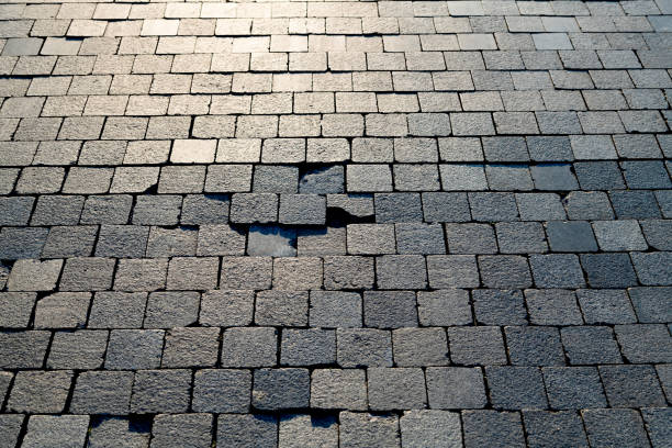 Free picture: Close-up of concrete distorted shape blocks on asphalt