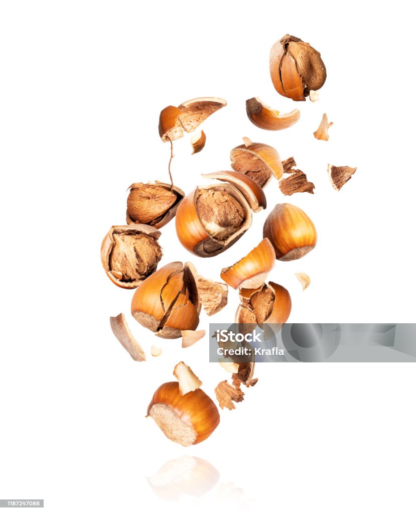 Crushed Hazelnuts Frozen In The Air On A White Background Stock Photo ... Crushed Hazelnuts Frozen In The Air On A White Background Stock Photo ...
