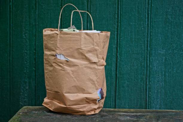Free picture: Paper bag with steel nails and rusty pliers on a wooden table