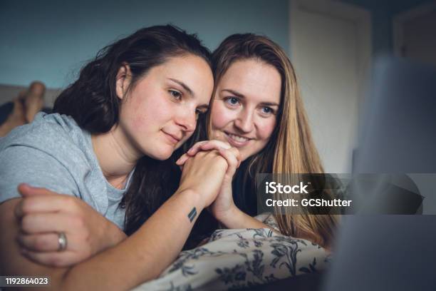 Love Is Love Lesbian Couple Watching Video Streaming Using Laptop Stock