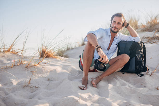 Free Stock Photo of Man Sitting on Beach With Camera | Download Free ...