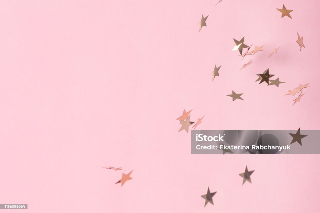 Silver Star Confetti On Pastel Pink Background Bright And Festive