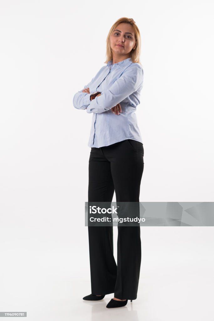 Portrait Of Smiling Business Woman With Folded Hands Isolated On White