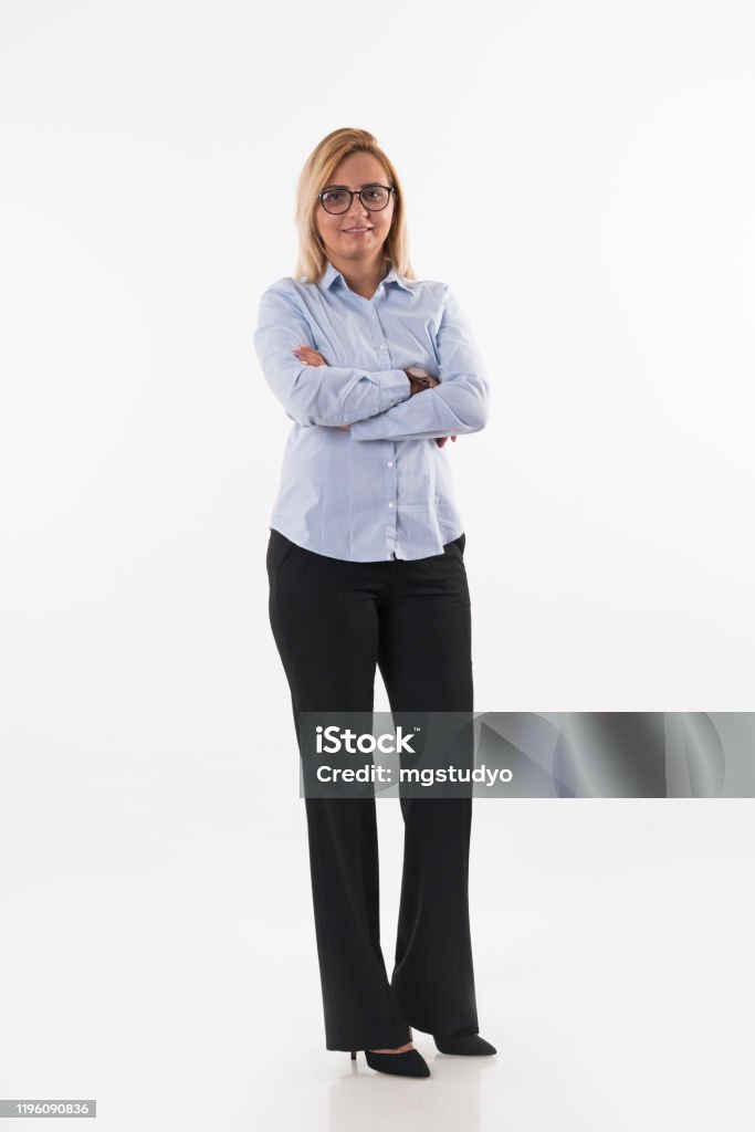 Portrait Of Smiling Business Woman With Folded Hands Isolated On White