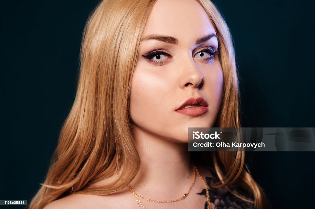 Blonde With Long Hair Looking At The Camera Professional Makeup