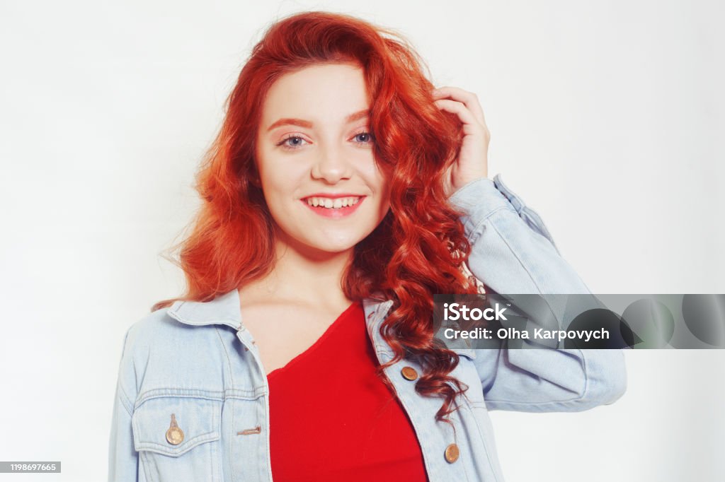 Portrait Of Beautiful Cheerful Redhead Girl With Flying Curly Hair
