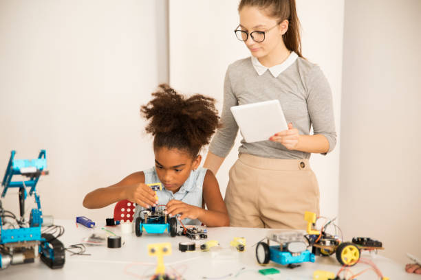 Free Stock Photo of Two girls working with a machine in a STEM robotics ...