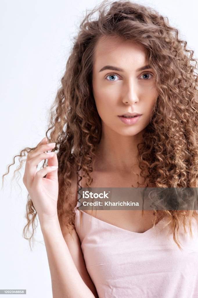 Beautiful Curly Hair Smiling Girl With Healthy Wavy Long Blonde Hair