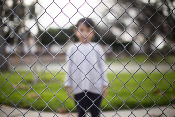 Free Stock Photo of Person Standing Behind a Fence | Download Free ...