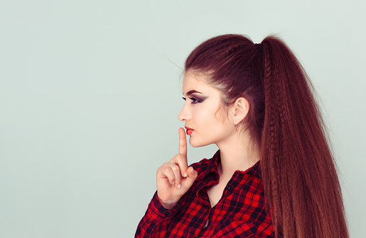 Closeup Portrait Profile View Secretive Young Woman Placing Finger On