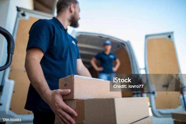 Coworkers Rushing To Load Packages In A Delivery Van Stock Photo ... Coworkers Rushing To Load Packages In A Delivery Van Stock Photo ...