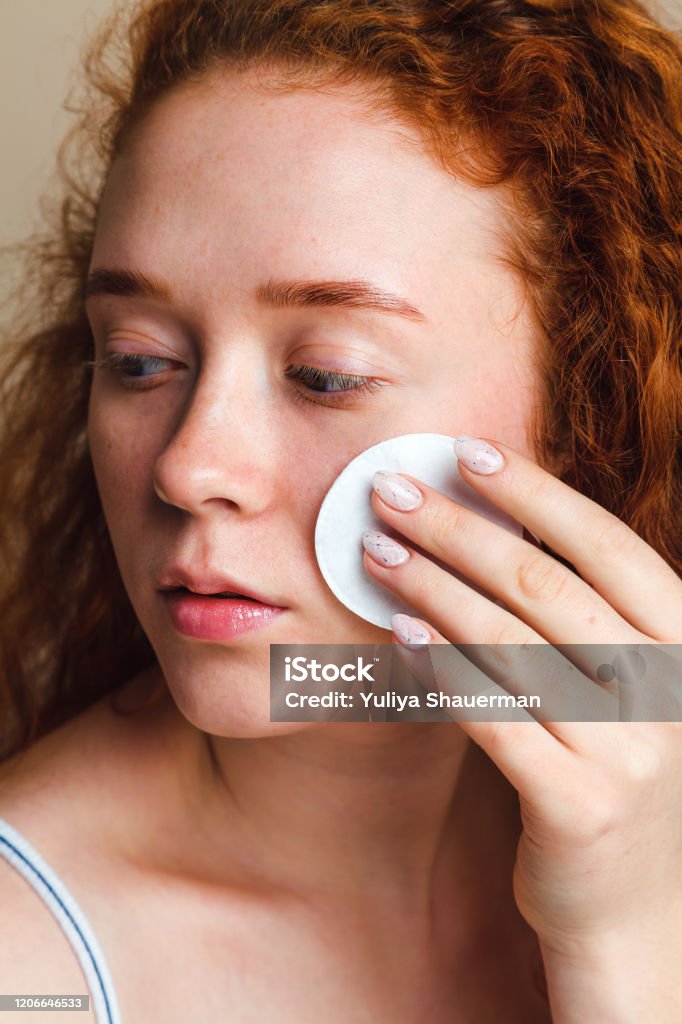 Teenage Skin Care Concept Young Beautiful Redhaired Girl With Long Curly Hair Cleanses Her Face