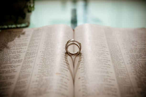Free Stock Photo of Two Wedding Rings Resting on an Open Bible ...