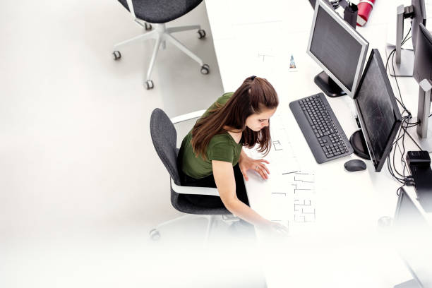 Free Stock Photo of Businesswoman working on laptop in office - looking ...