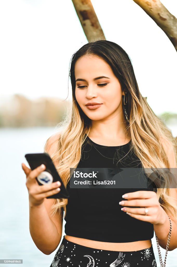 Beautiful Young Latina Woman 18 Year Old Uses Cell Phone Outdoors Stock