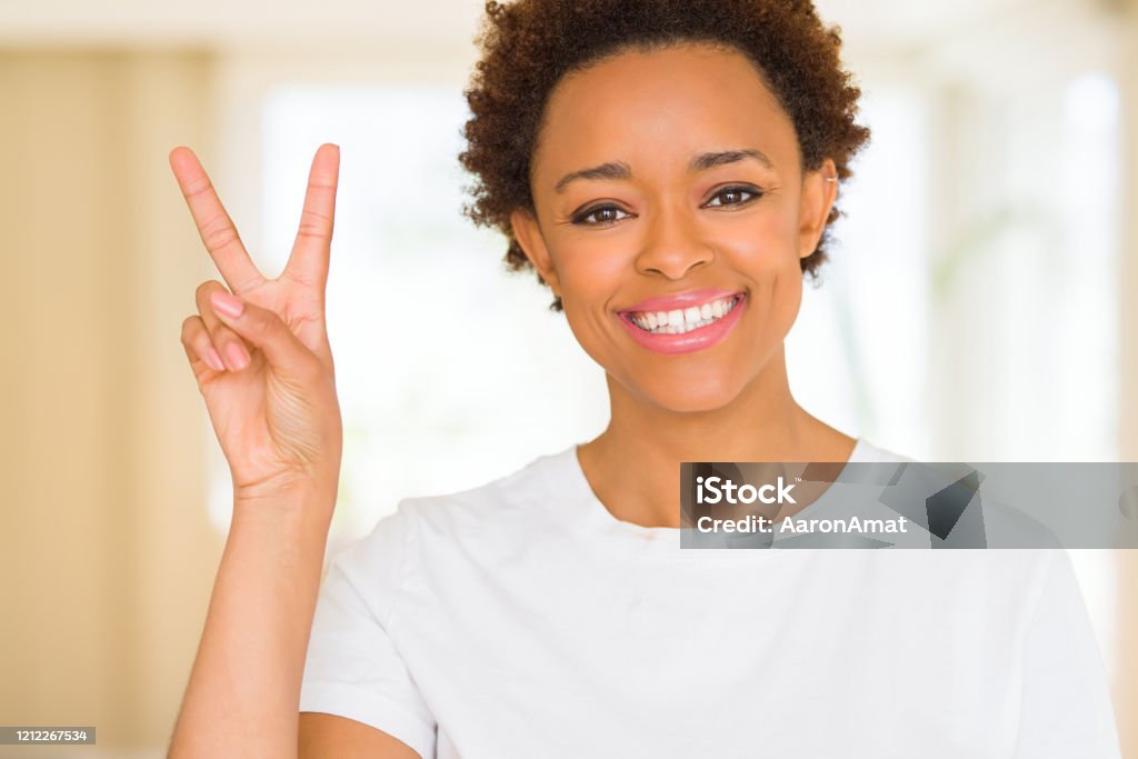 Young Beautiful African American Woman Wearing Casual White Tshirt