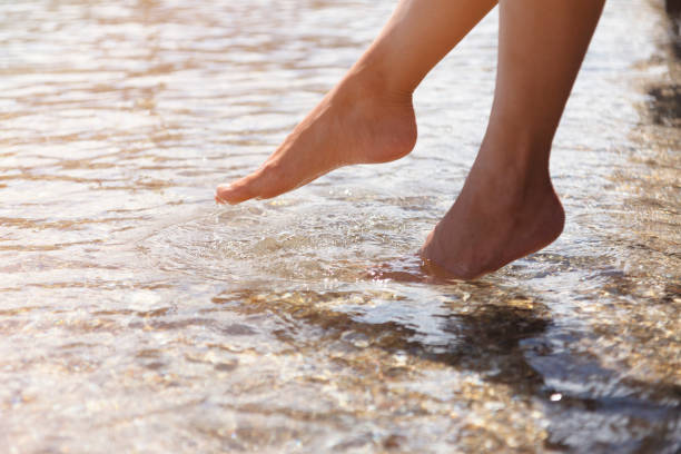 Free Stock Photo of Feet dipped in clear shallow water with ripples ...