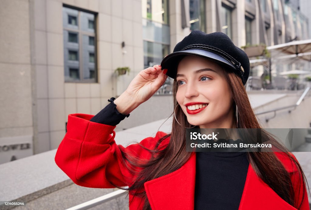 Ravishing Luscious Delightsome Girl In Red Overcoat Holds Her Kepi By