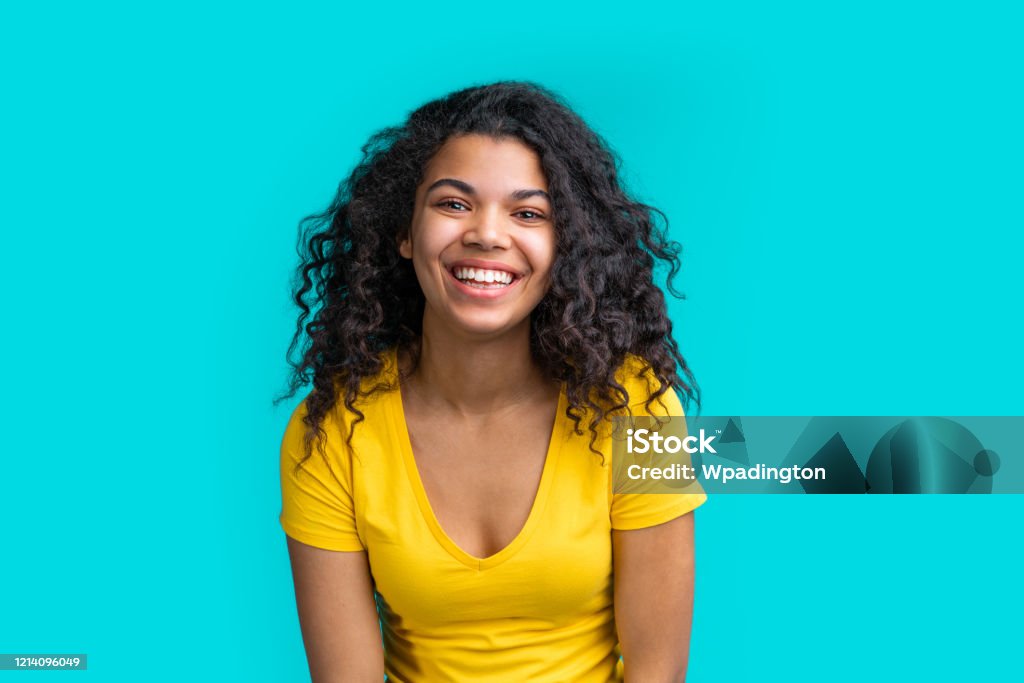 Portrait Of Beautiful Smiling Dark Skinned Girl Wearing Bright Colored
