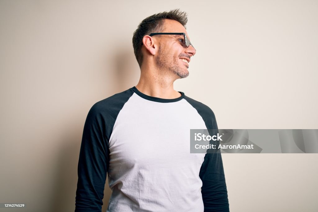 Young Handsome Man Wearing Funny Thug Life Sunglasses Meme Over White