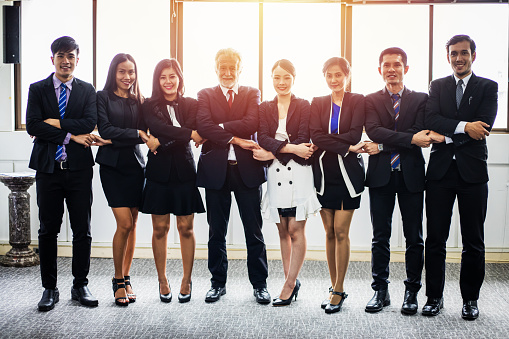 Smiling Happy Businessman And Businesswomen Celebrating Success