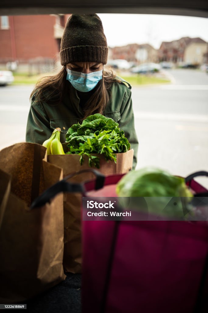 Mature Woman Unloading Grocery From Car Trunk Stock Photo - Download ... Mature Woman Unloading Grocery From Car Trunk Stock Photo - Download ...
