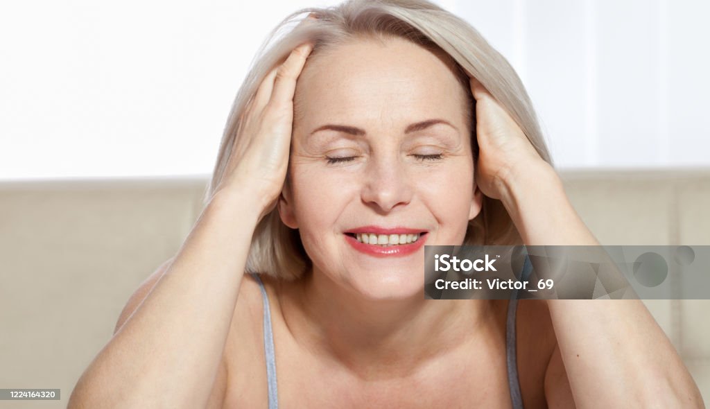 Fifty Year Old Woman Is Very Pleased With Her Wellgroomed Face Plastic