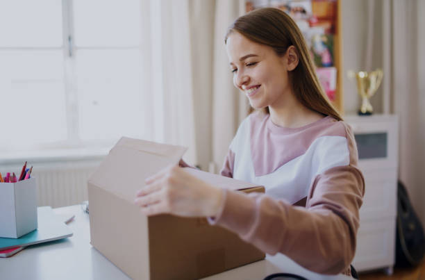 Free Stock Photo of Lifestyle. Woman opening a box at her desk ...