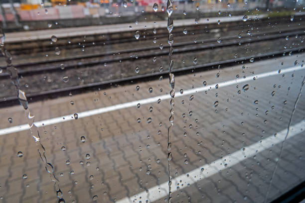 Free Stock Photo of A View of a Train Track Through a Rain Covered ...